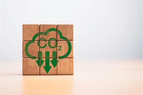 Premium Photo Co2 Reducing Icon Print Screen On Wooden Cube For