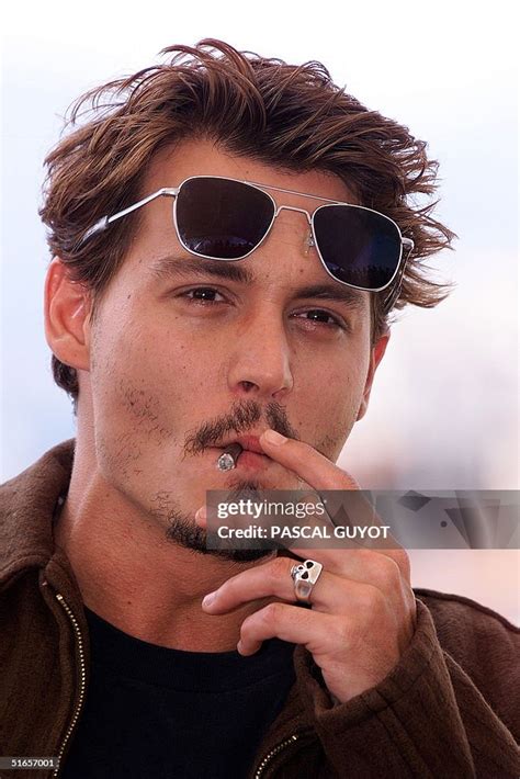 Us Actor Johnny Depp Poses For Photographers During A Photocall For