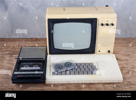 Retro 8 Bit Diy Home Computer With Cassete Data Recorder And Monitor From Tv Set On Wooden Desk