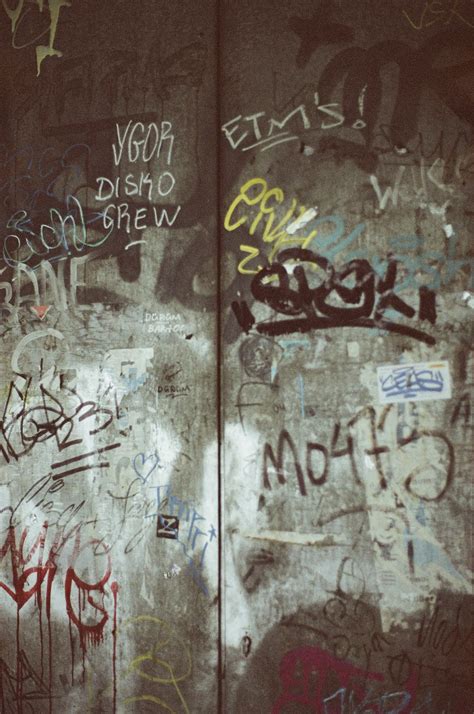 A Graffiti Covered Wall Photo Free Vintage Image On Unsplash