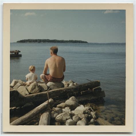 Father And Young Son In The Summer At A Lake Before Going Swimming By