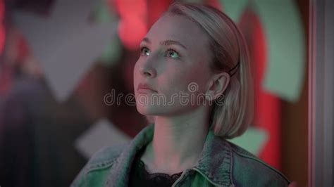 Young Blond Woman Exploring Room Of Mirrors In Dreamlike Fantasy Neon