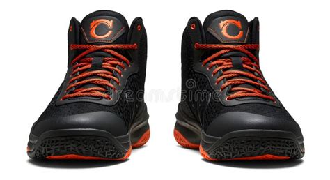 Pair Of Black Basketball Shoes With Orange Accents Stock Illustration
