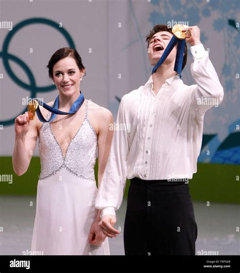 Tessa Virtue L And Scott Moir Of Canada Hold Up Their Gold Medals