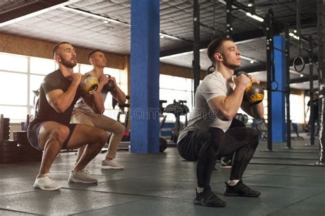 Group Of Men Bodybuilder Side View Showing Biceps Of His Arms Editorial