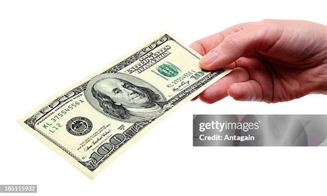Hand Holding 100 Bills Photos And Premium High Res Pictures Getty Images