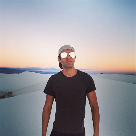 Chris Vij Standing On White Sand Beach