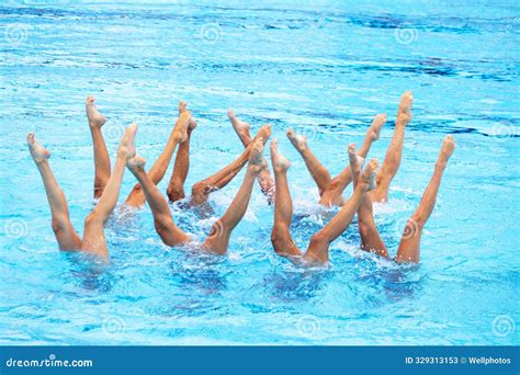 Artistic Swimming Team Performing Synchronized Legs Movement In
