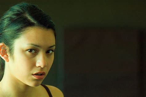 Young Woman Scowling At Camera Portrait License Image 70358734