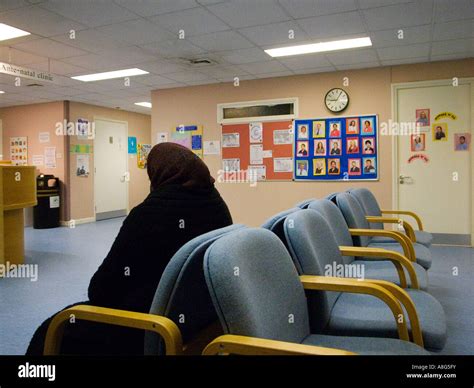Muslim Woman Sitting In A Waiting Room In Matiernity Unit In A Nhs