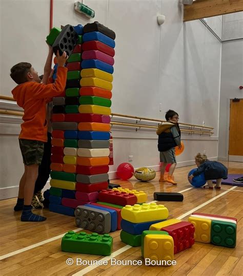 Large Building Bricks Like Lego Bouncy Castle Hire Soft Play Games And Inflatable Slide Hire