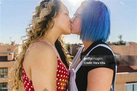 Closeup Portrait Of Caucasian Gay Women In Love Kissing At Sunset High