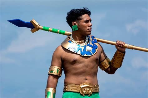 Man With Traditional Tattoos Of The Mentawai Tribe Holding A Spear And