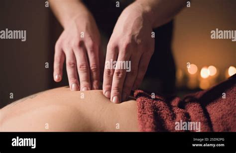 Young Male Massage Therapist Is Doing Finger Massage Of A Woman Back