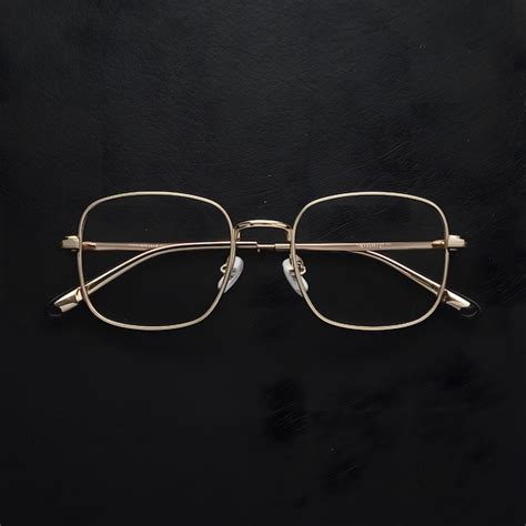 Premium Photo Gold Rimmed Glasses Create Striking Contrast Against Black Background For Social