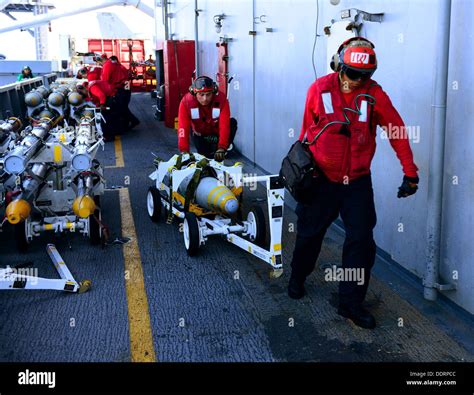 Us Navy Aviation Ordnanceman Airmen Jackie Kazziahand Darrius Griffin
