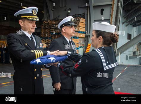 Handout File Photo Dated January 20 2020 Of Capt Brett Crozier Left