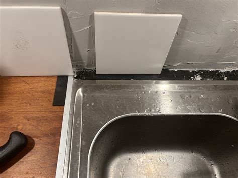 Kitchens Fill The Space Behind Sink And Wall And Prepare For Tiling