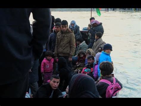 Iraq Syrian Refugees Cross The Border By Barge Youtube