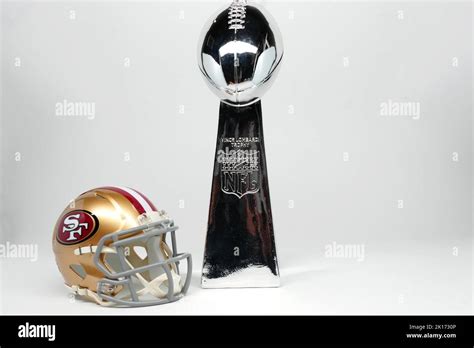 A San Francisco 49ers Helmet And Super Bowl Vince Lombardi Trophy