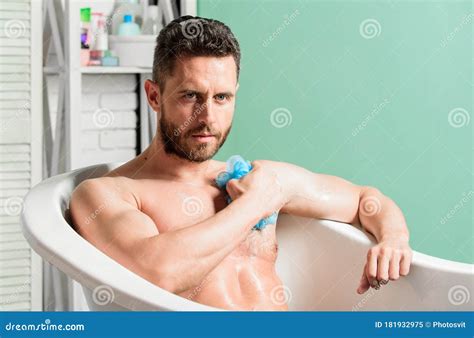 Man Wash Muscular Body With Foam Sponge Wash Off Foam With Water