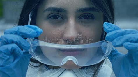 Young Middle Eastern Woman Sets Up Outdoor Science Experiment Stock