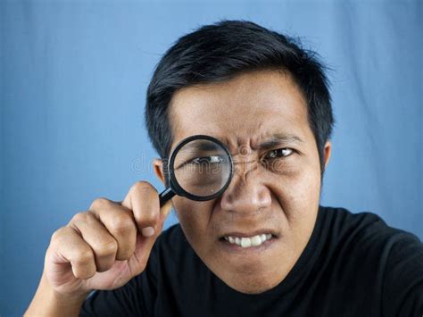 Funny Expression Asian Man Looking Through Magnifying Glass Searching