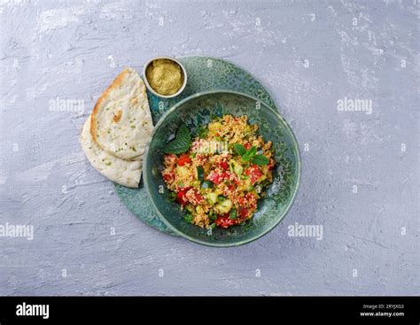 Traditional Moroccan Vegetable Couscous With Pita Bread And Hummus