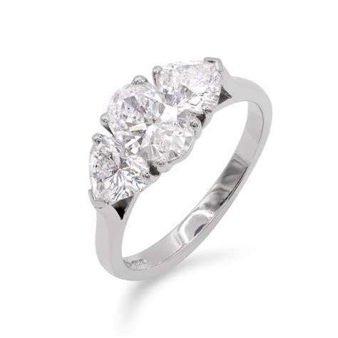 Platinum Oval And Heart 3 Stone Diamond Ring