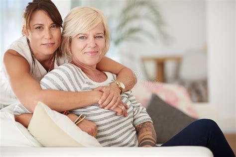 Portrait Hug And Lesbian Couple Relax In Home Together For Love