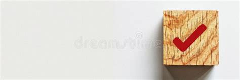 Wooden Block With Check Mark Icon On White Background Flat Lay Top