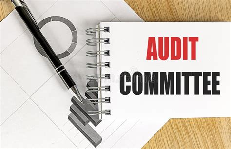 Audit Committee Text On Notebook With Chart On Wooden Background Stock