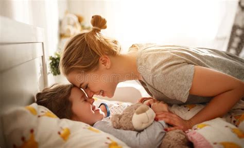 Mother Wakes Her Daughter In Bed In Morning Stock Image Image Of