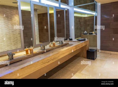 Luxury Hotel Restroom Interior With Marble Sinks Modern Mirrors And