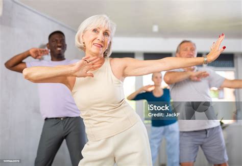 Mature Men And Women Practicing Hiphop Dance In Training Hall Stock