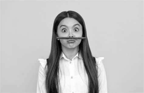 Premium Photo Fun At School Funny Girl Hold Pen As Mustache School