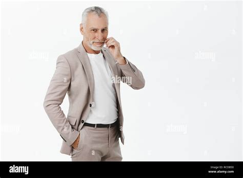 Handsome Charismatic Senior Businessman Rolling Moustache With Fingers