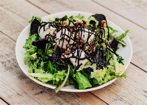 Premium Photo Gourmet Plate Of Caesar Salad With Chicken Parmesan And