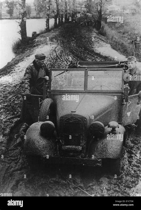 German Soldier And Officer Pushing Their Car Through Russian Mud In