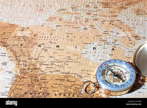 Compass On A Map Pointing At Canada Planning A Travel Destination