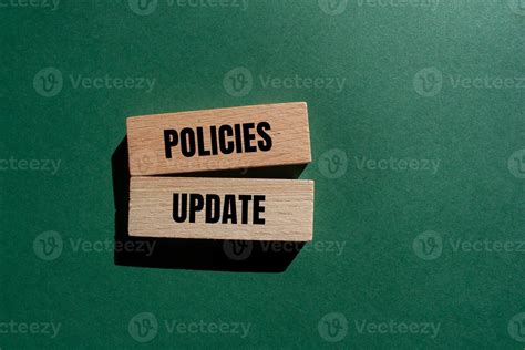 Policies Update Message Written On Wooden Blocks With Green Background