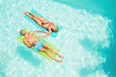 Peaceful Couple On Lilos Holding Cocktails Lakeway Resort And Spa Hill Country Resort Pool