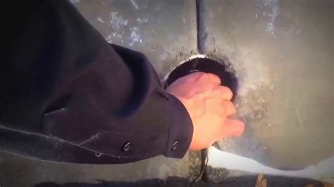 Businessman Stomping Toy On Wall Street With Dress Shoe