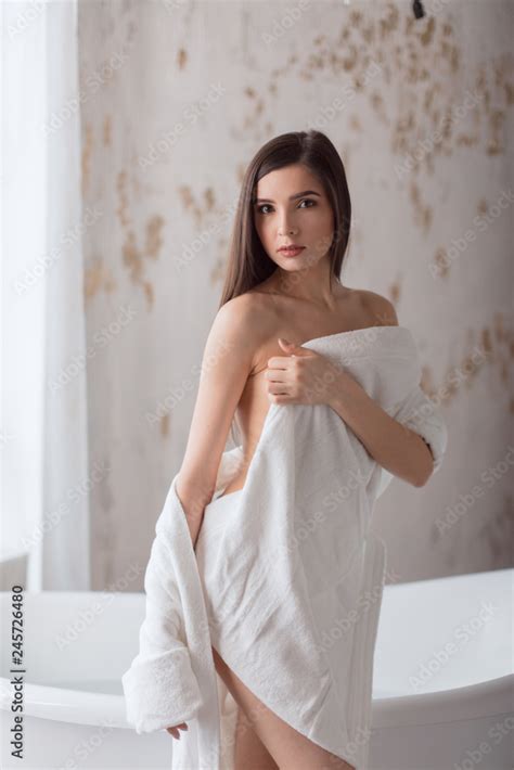 Young Sexy Sensual Elegant Woman With Long Brown Hair Wearing White