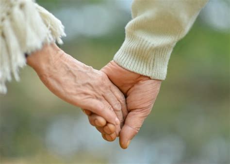 Elderly Couple Holding Hands Born Realist