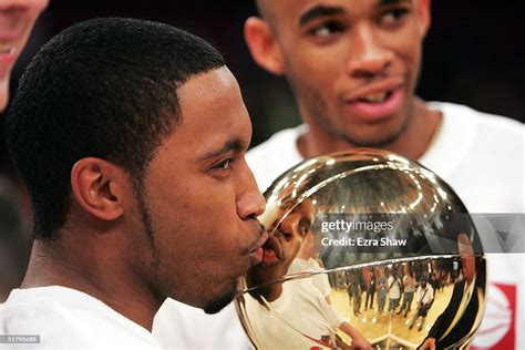 Taron Downey Of Wake Forest Kisses The Trophy After Their Win Over