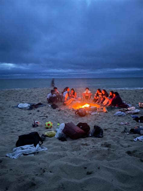 Beach Bonfire With Friends In 2024 Beach Bonfire Party Ideas Beach