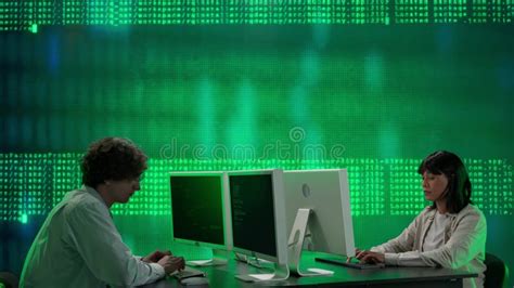 It Specialists Against Big Digital Screen Man And Woman Programmers