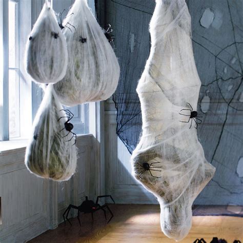 Hanging Cocooned Man And Spider Larva Balls The Green Head