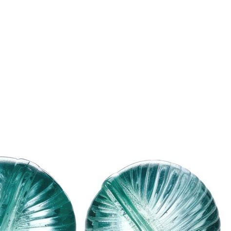 Premium Photo Three Green Glass Shells With A White Background